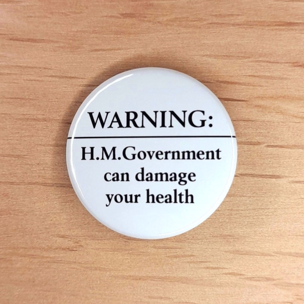 Warning: H.M.Government can damage your health – Rainbow Badges